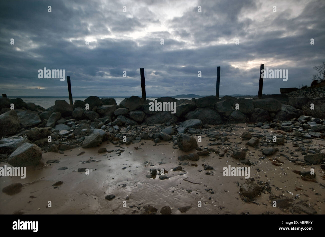Wooden posts along the County Down coast, Northern Ireland Stock Photo ...