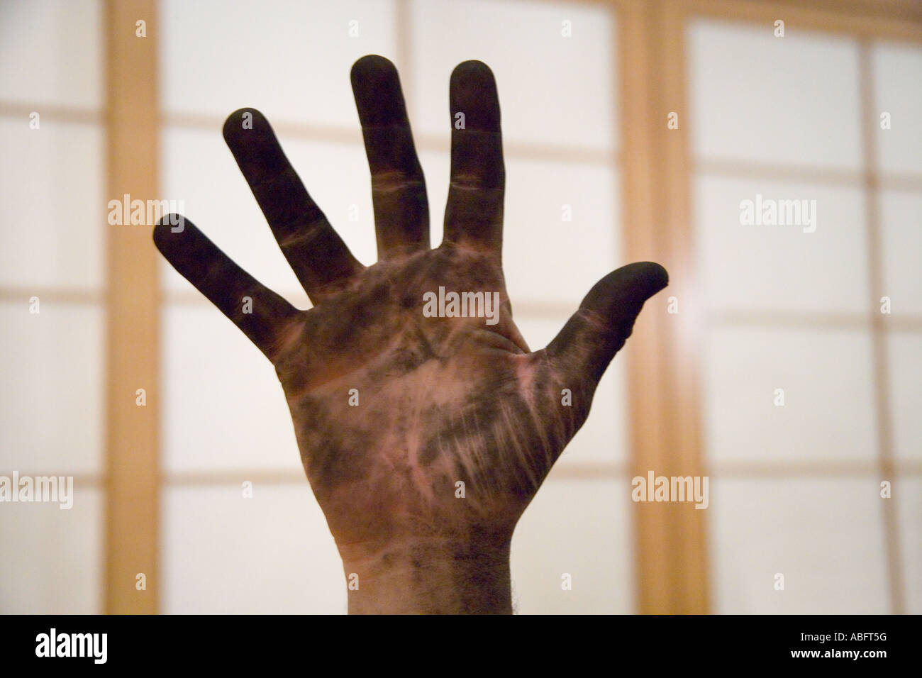 Blackened male hand Stock Photo - Alamy
