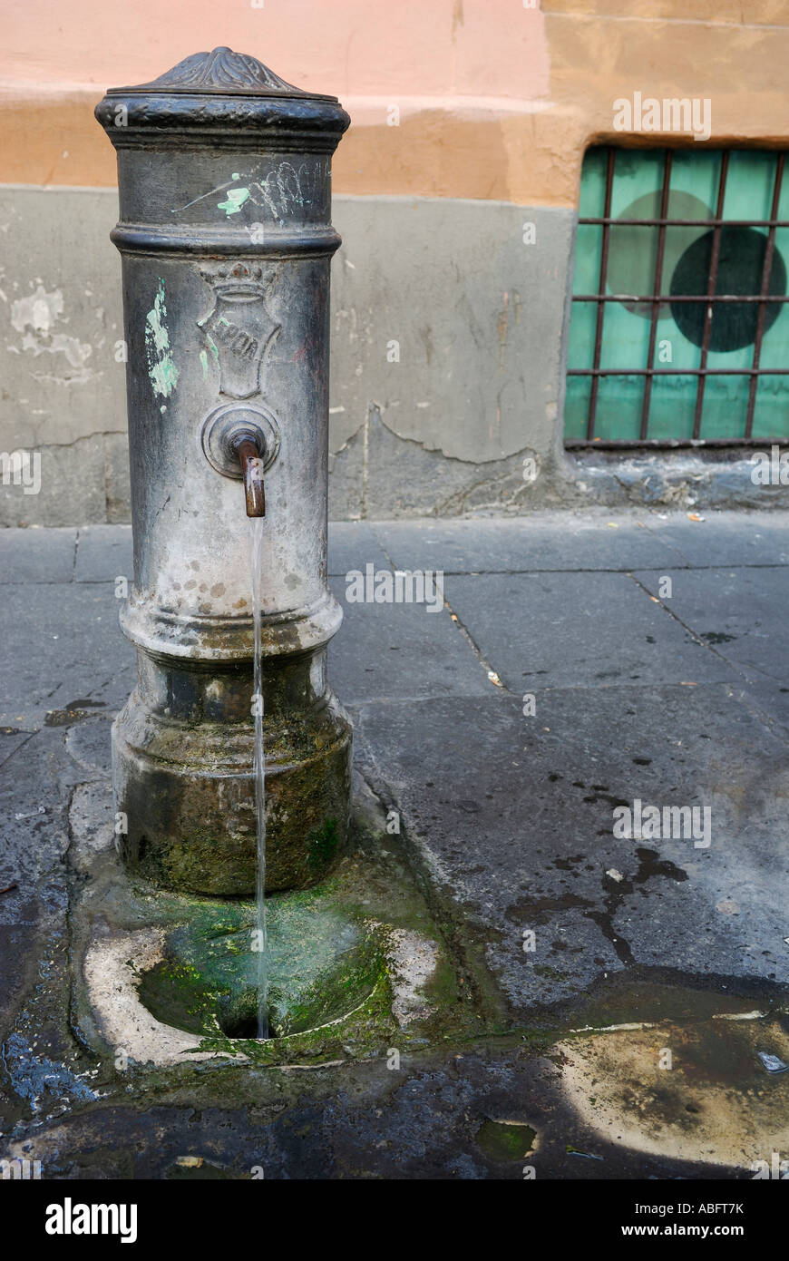 Sidewalk fountain with water flowing on a street in Rome Italy Stock ...