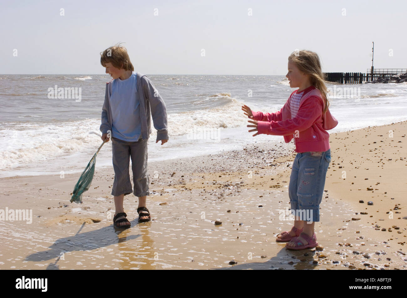 Girl running from waves hi-res stock photography and images - Alamy
