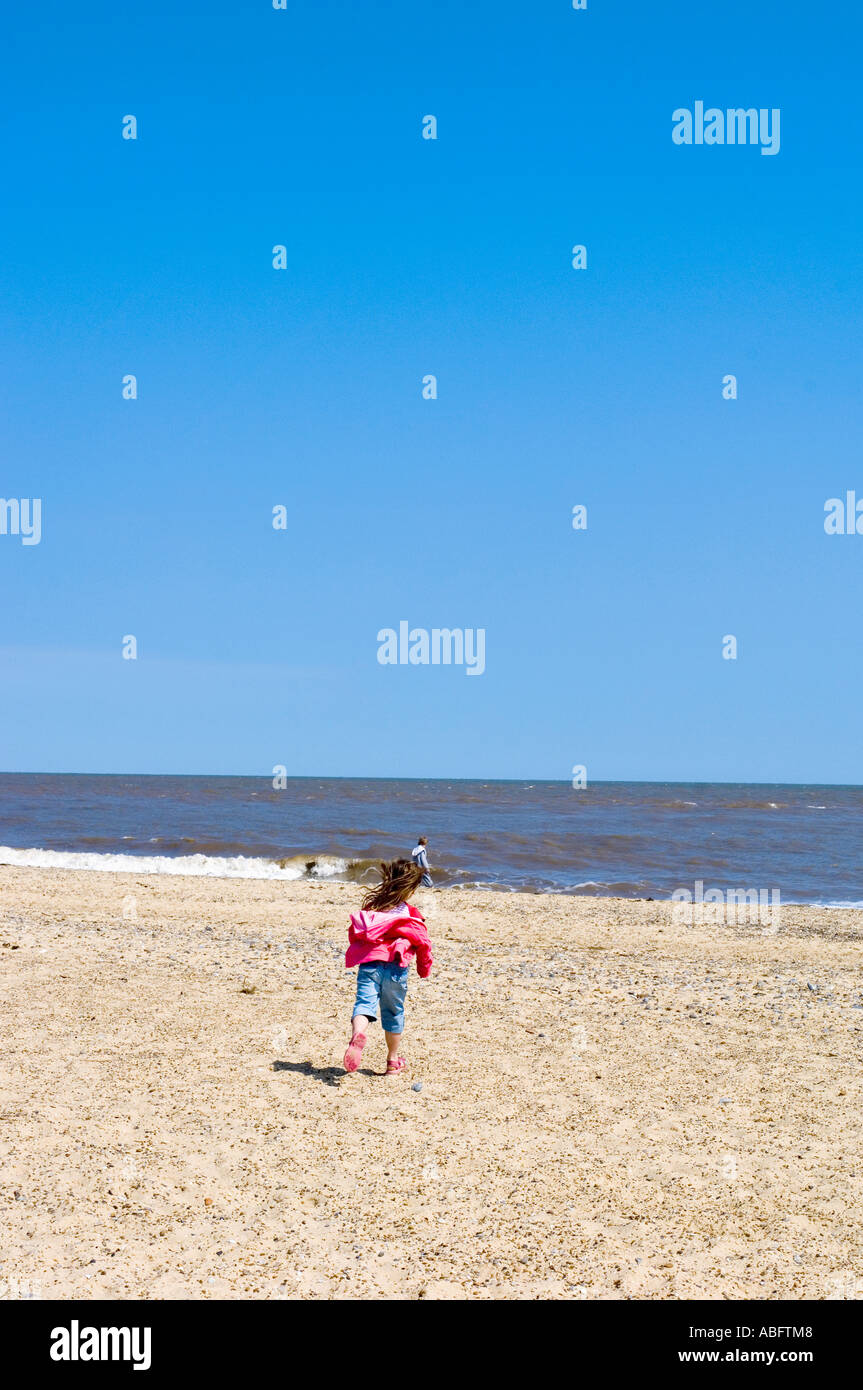 Young Girl Running to Sea Stock Photo - Alamy