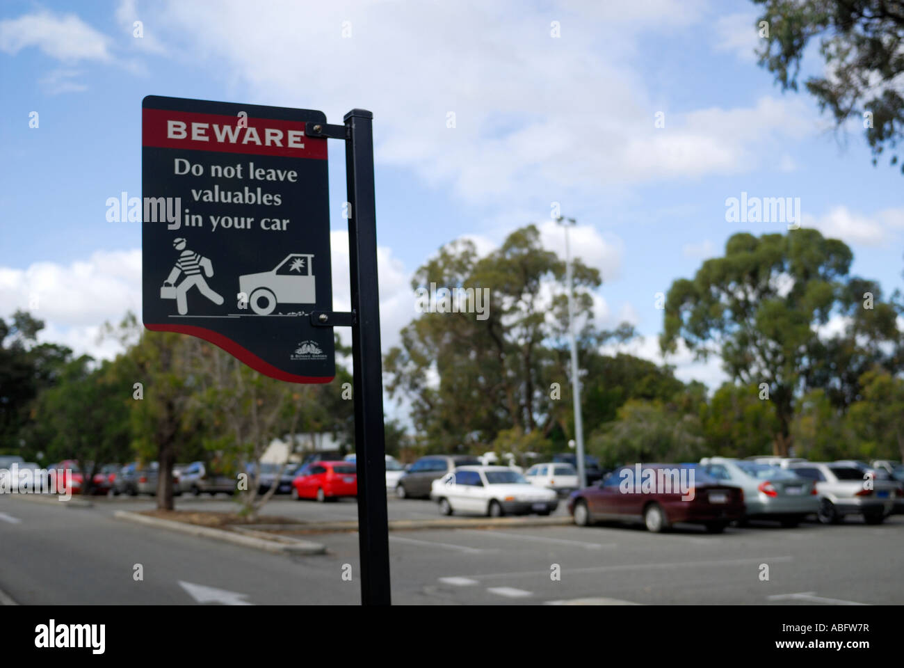 sign in carpark warning against theft Stock Photo - Alamy