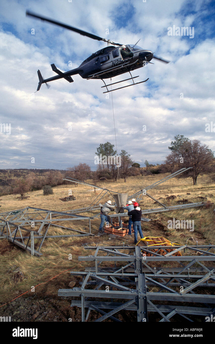 A helicopter works to install power lines in California Stock Photo - Alamy