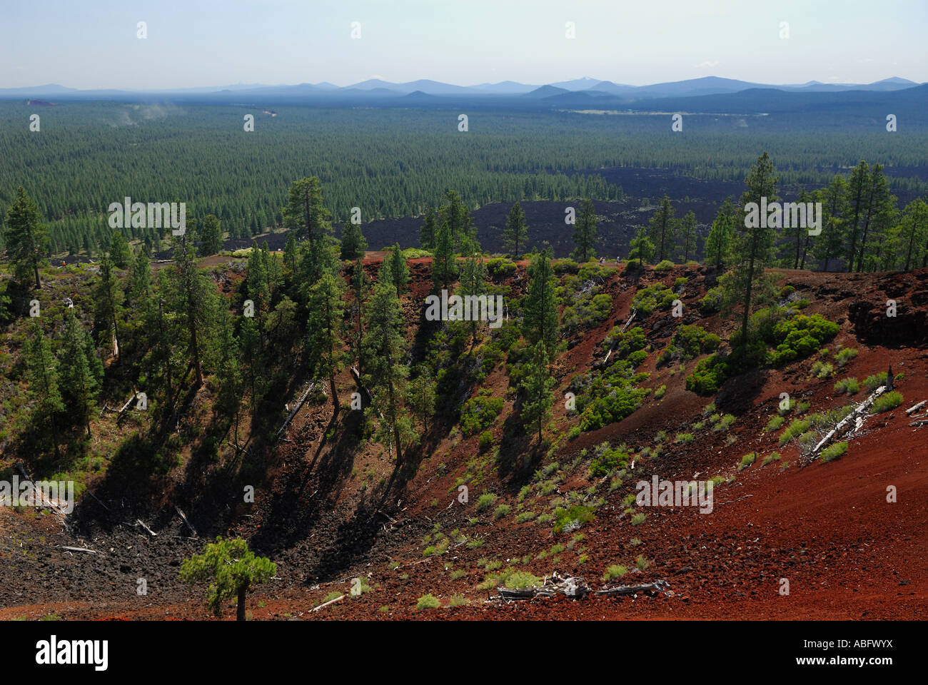 Center of Lava Butte cinder cone with lava flow and Cascade mountains ...