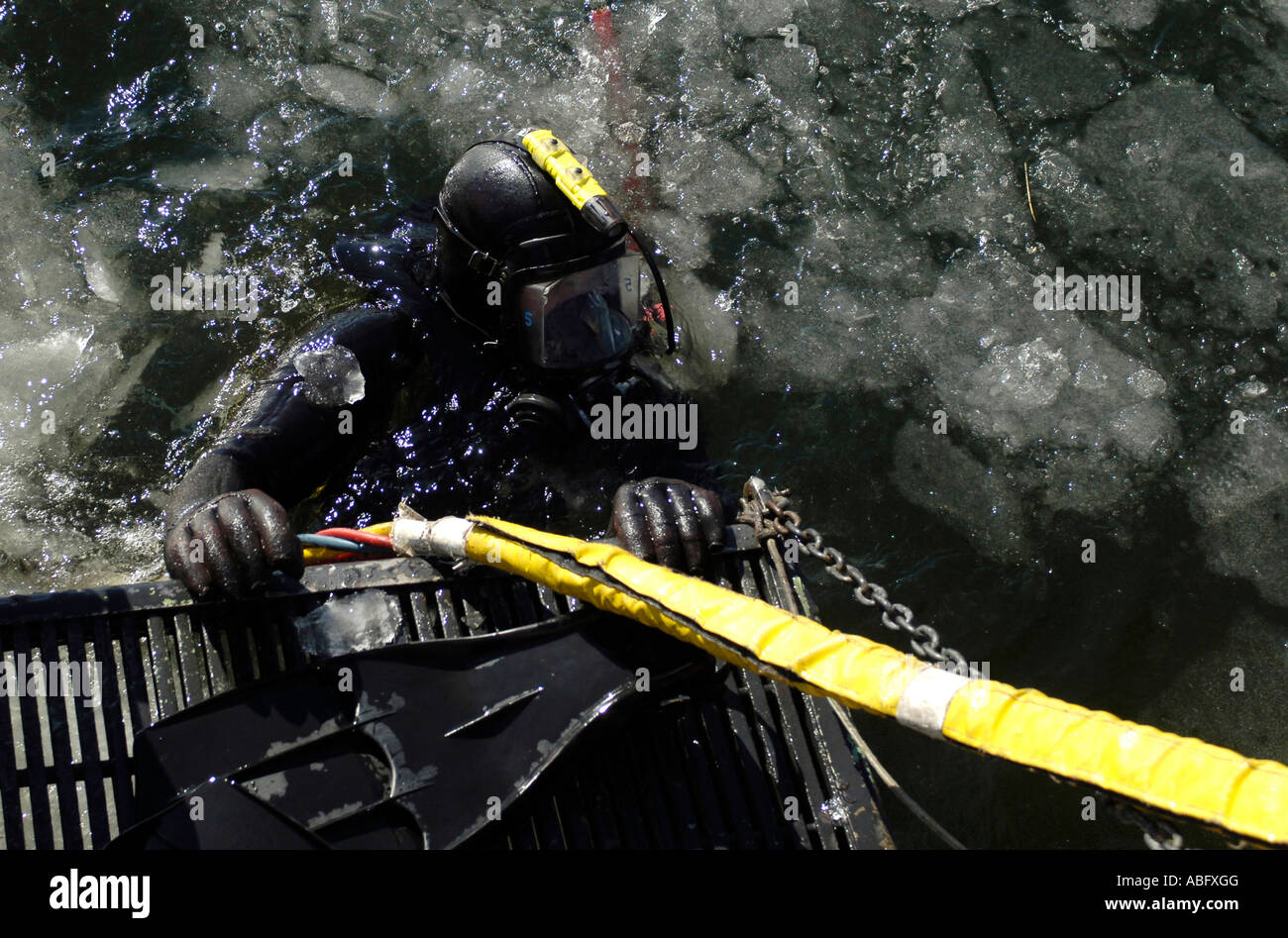 U.S. Navy Diver gets ready to start his dive off the back of a dive ...