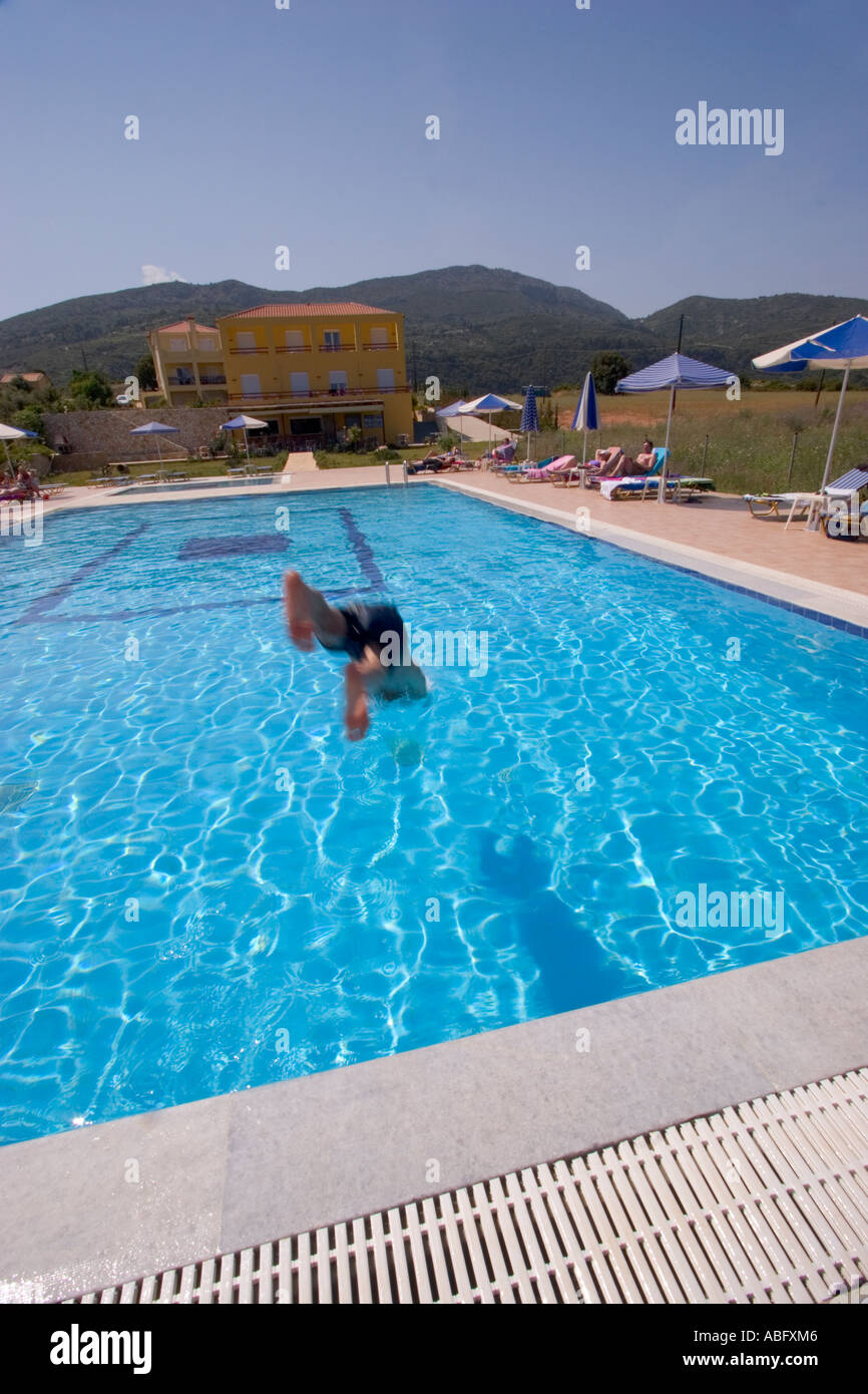 Man Diving into Swimming pool with splash Stock Photo - Alamy