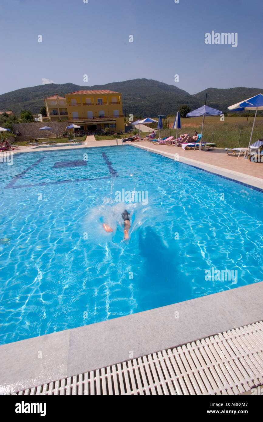 Man Diving into Swimming pool with splash Stock Photo - Alamy