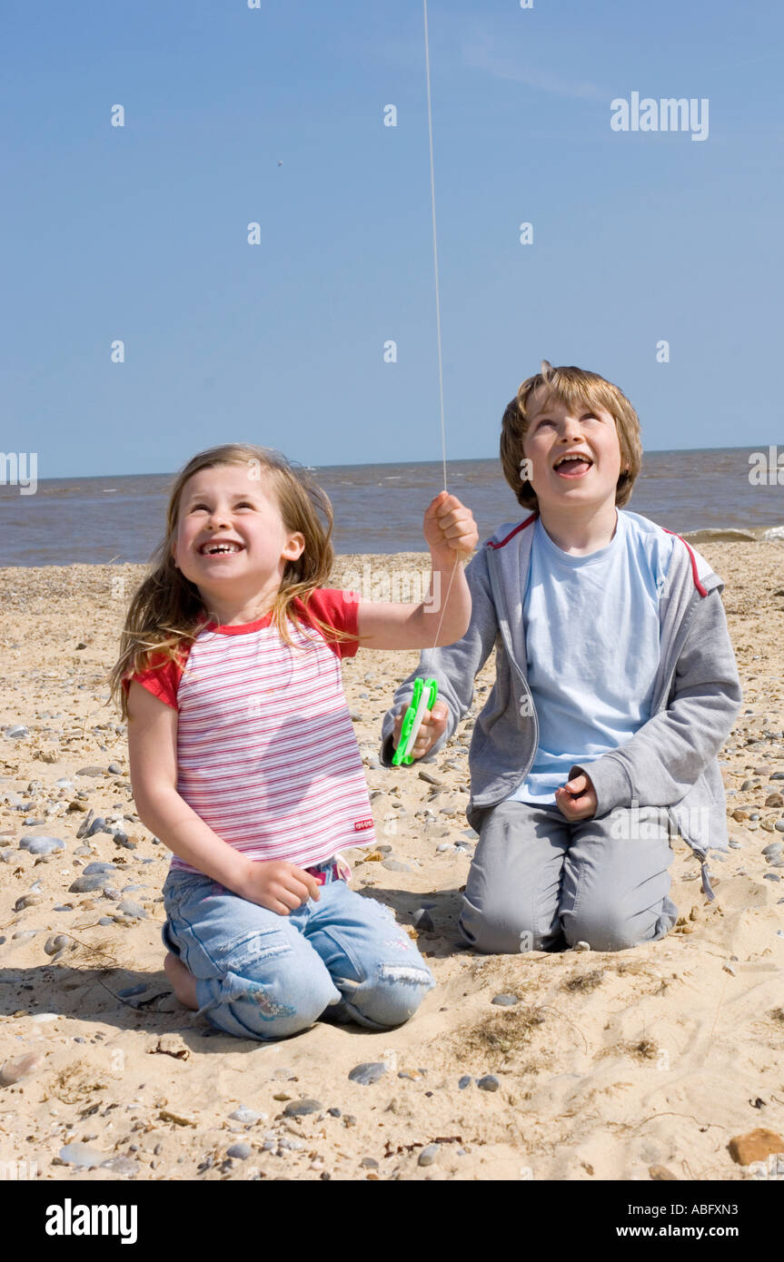 Young Children Playing With Kite Strings Stock Photo - Alamy