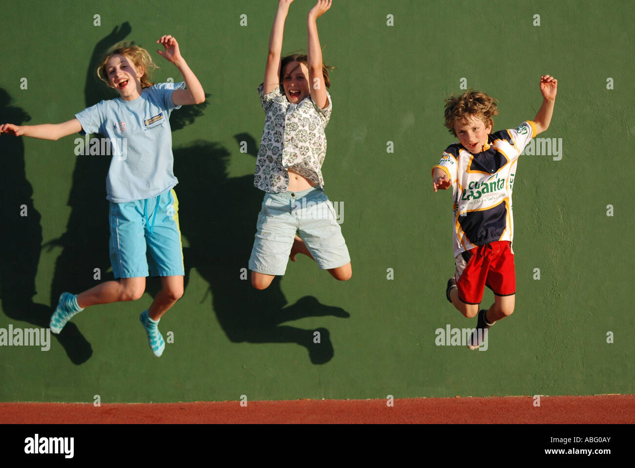 children jumping in the air Stock Photo - Alamy