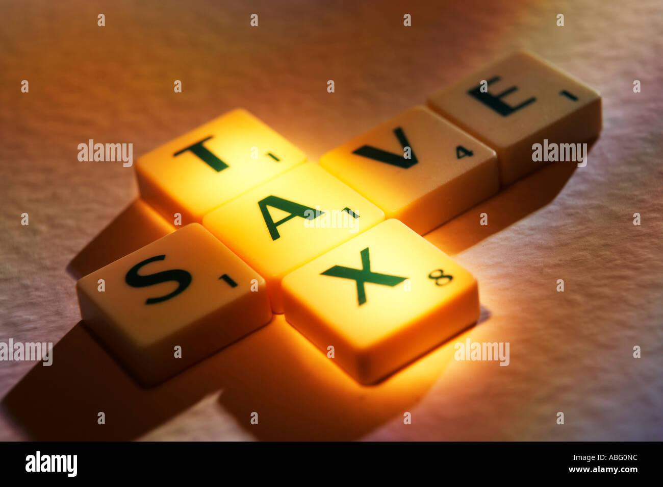 SCRABBLE BOARD GAME LETTERS SPELLING THE WORDS TAX SAVE Stock Photo - Alamy