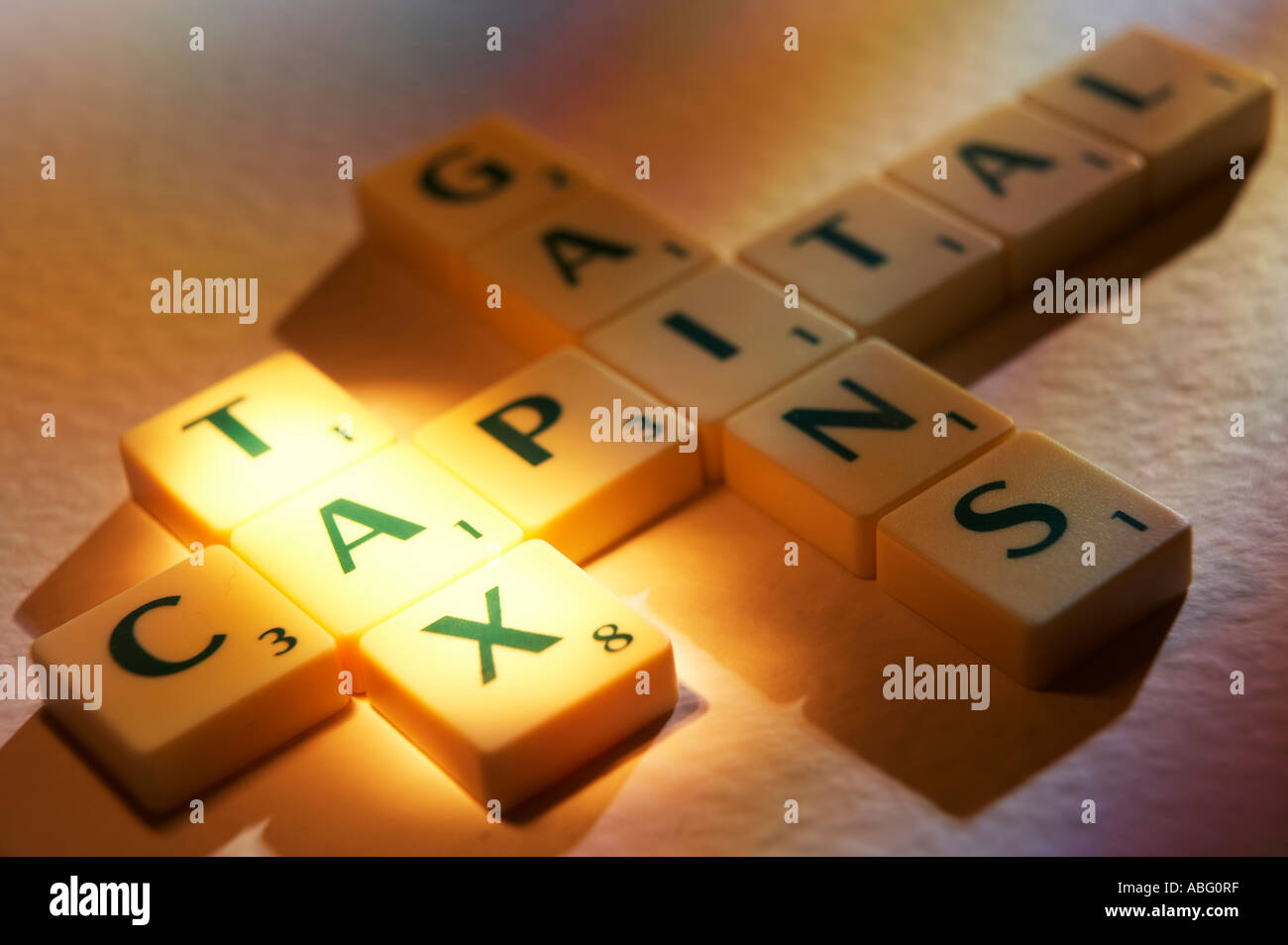 SCRABBLE BOARD GAME LETTERS SPELLING THE WORDS CAPITAL GAINS TAX Stock ...