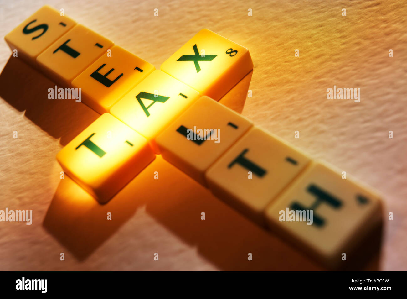SCRABBLE BOARD GAME LETTERS SPELLING THE WORDS STEALTH TAX Stock Photo ...