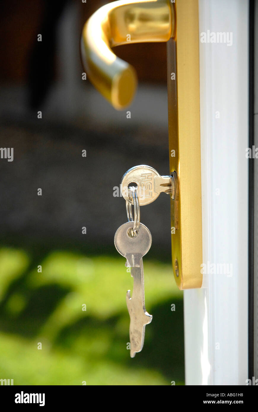 Key in door lock Stock Photo - Alamy