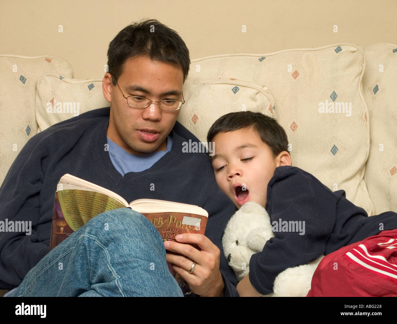 Filipino family reading hi-res stock photography and images - Alamy