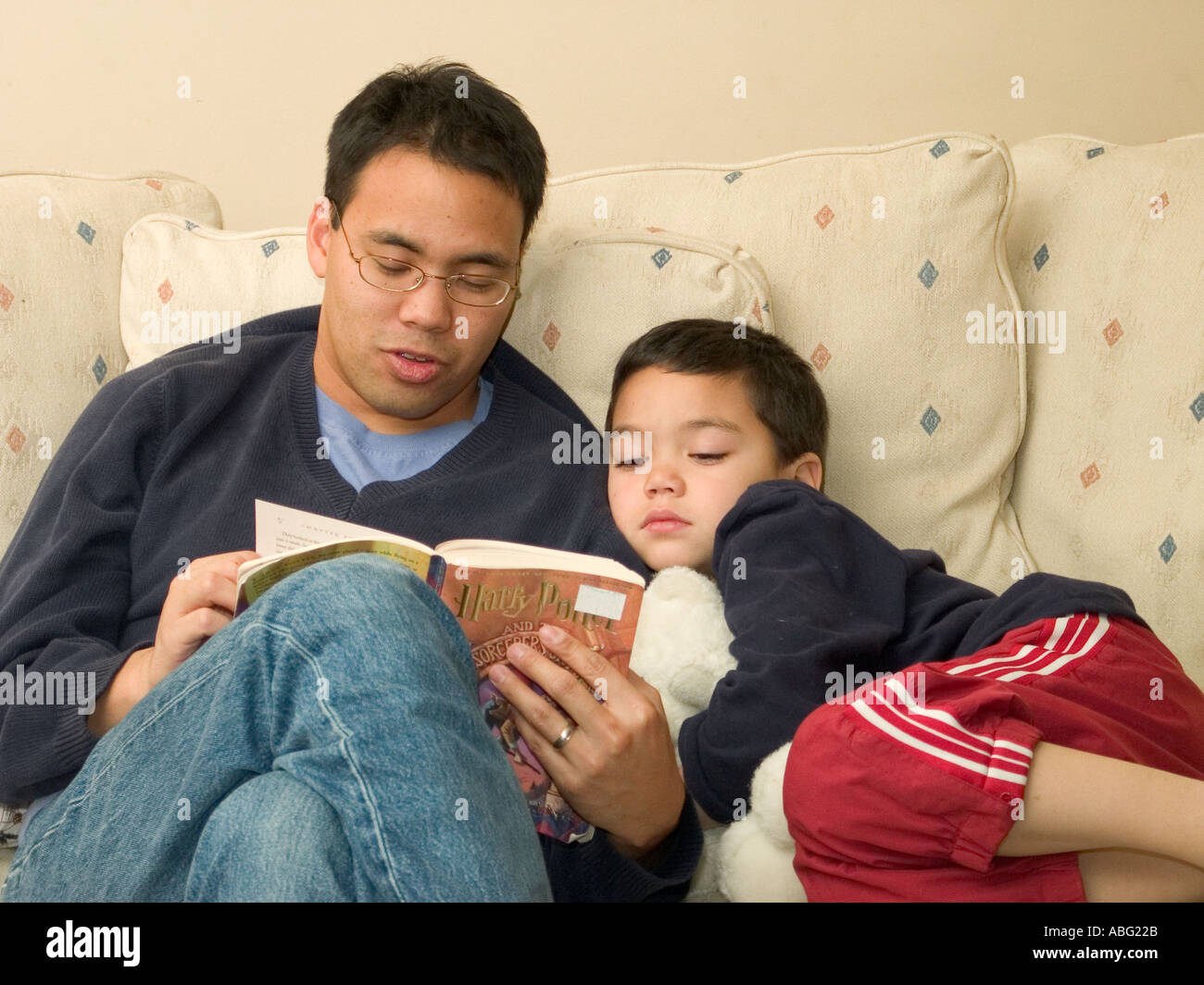 Filipino family reading hi-res stock photography and images - Alamy