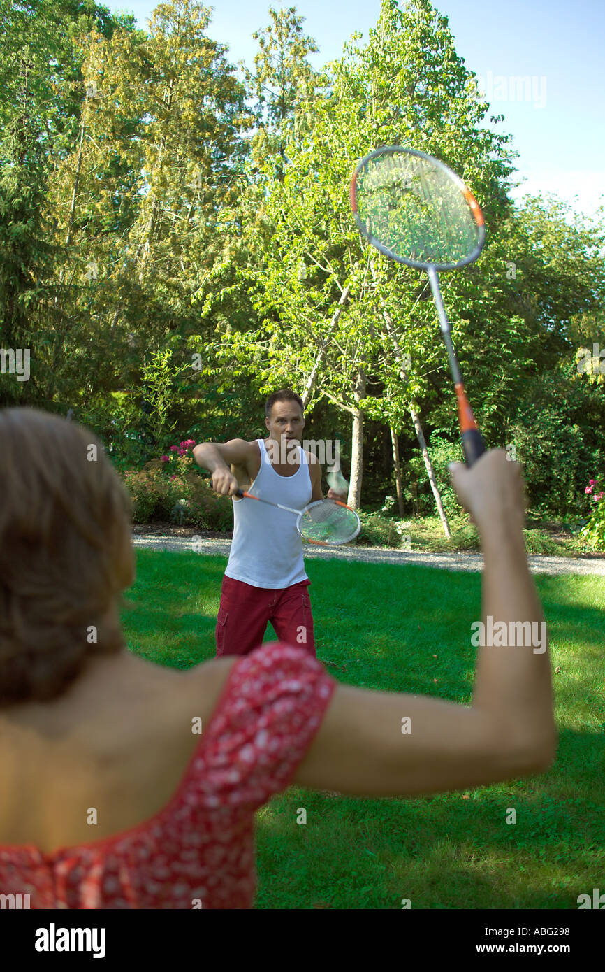 couple playing in garden playing badminton Stock Photo - Alamy