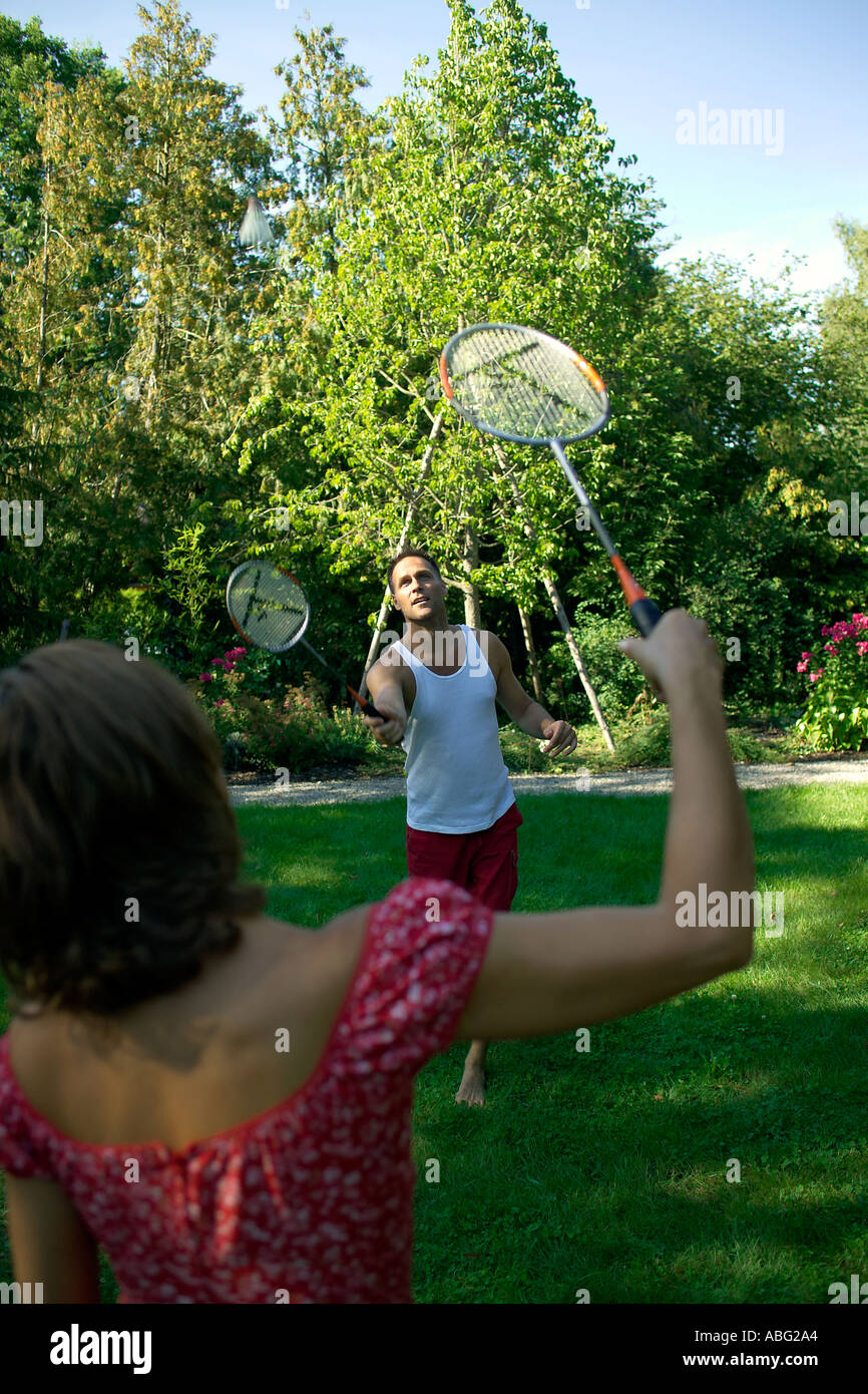 couple playing in garden playing badminton Stock Photo - Alamy