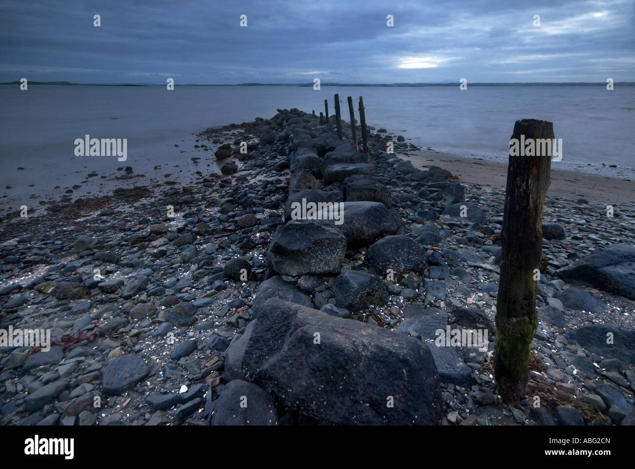 Wooden posts along the County Down coast, Northern Ireland Stock Photo ...