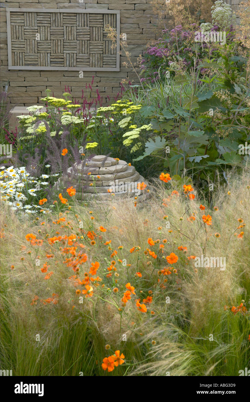 Cottage garden with stone features Stock Photo - Alamy
