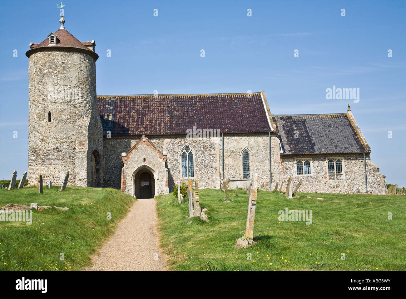 Rural churchyard with round tower church, Norfolk Stock Photo - Alamy