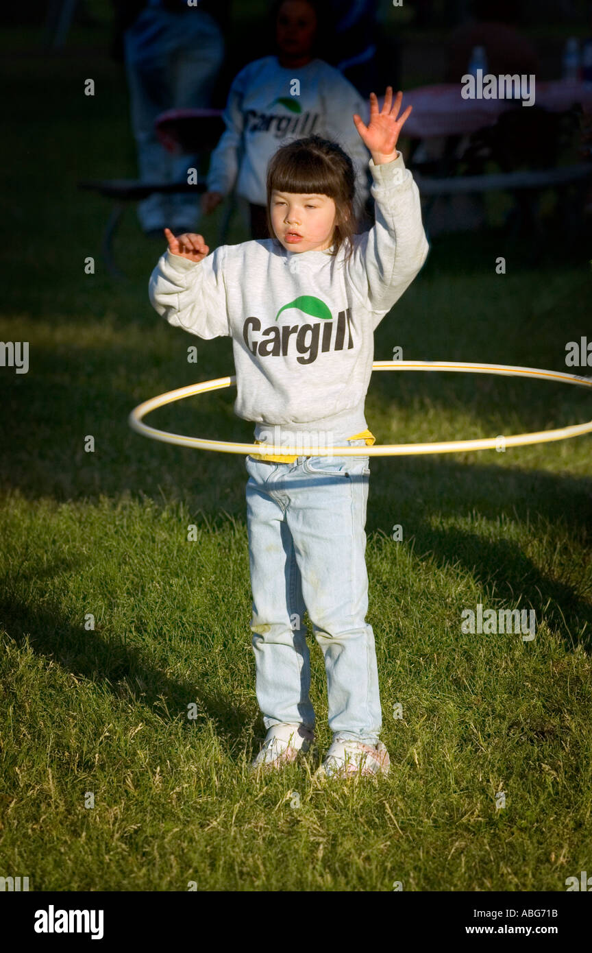 5 year old female American Indian child plays with a hula hoop Stock ...