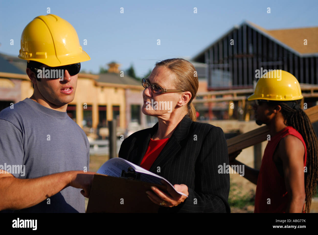 Contractor supervisor explaining progress to the female architect ...
