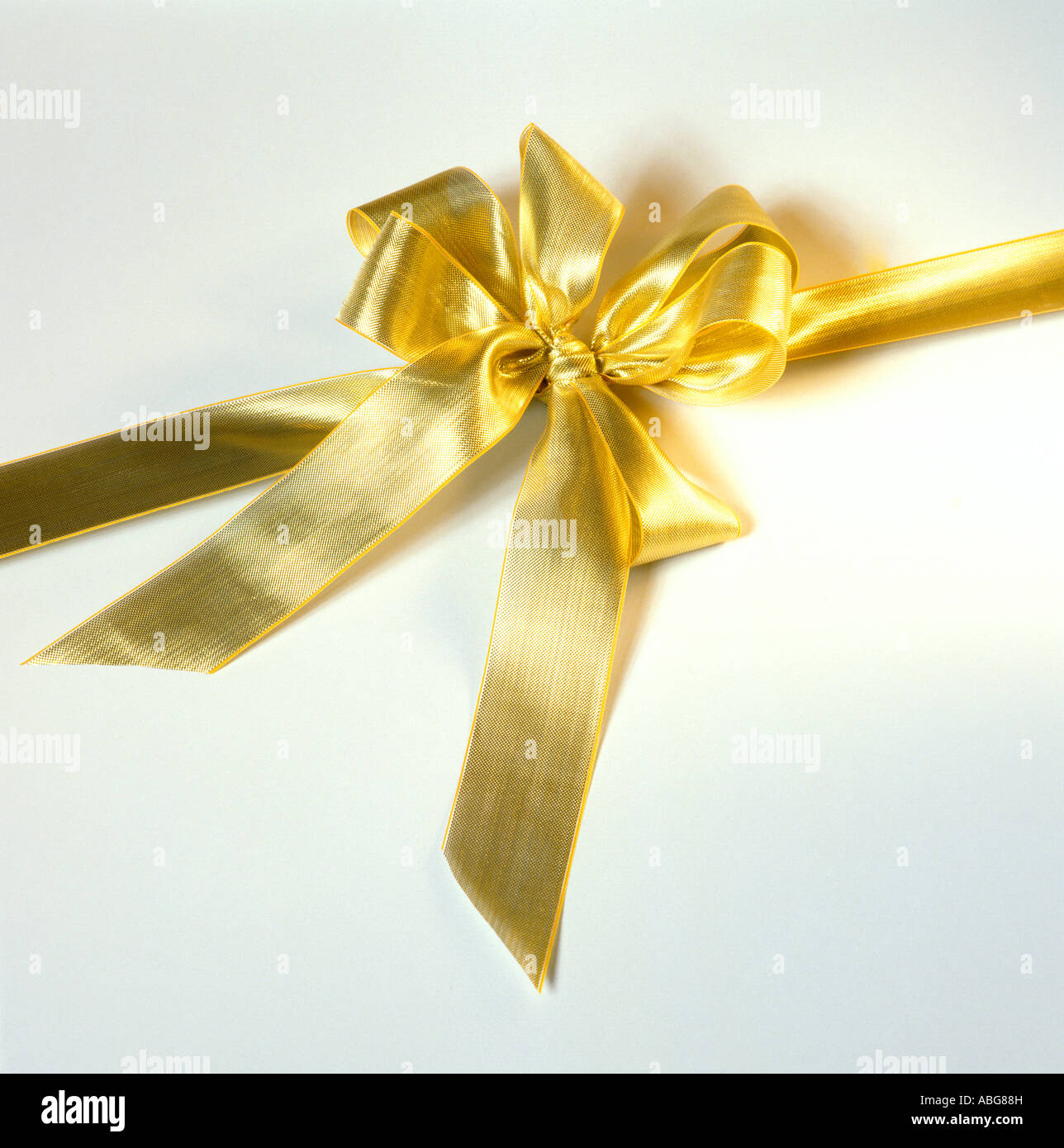 Ribbon of golden band for festive package Stock Photo - Alamy