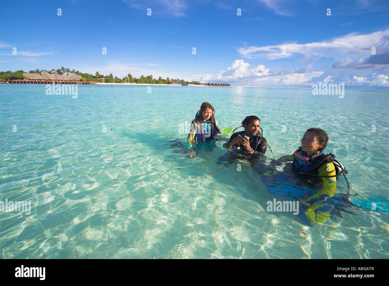Pupils with diving teacher, Maledives Stock Photo - Alamy