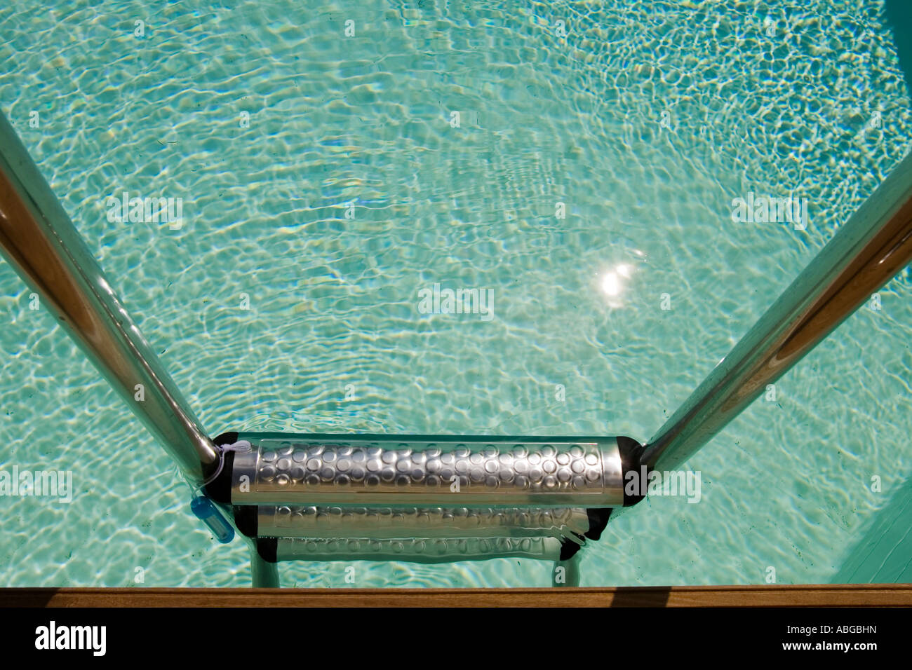 Swimming pool with ladder Stock Photo - Alamy