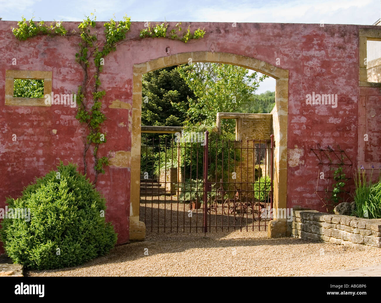 Pink entrance gate to a house in the village of Torgny Province de ...