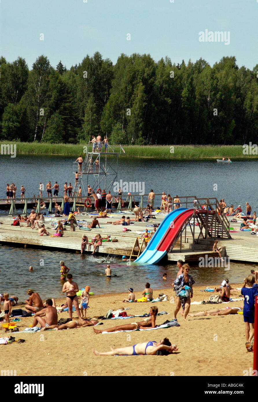 People enjoy the sun at the central lake in Elva Estonia Stock Photo ...