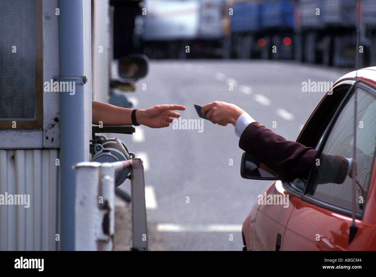 Driver hands over his passport on a border crossing Stock Photo - Alamy