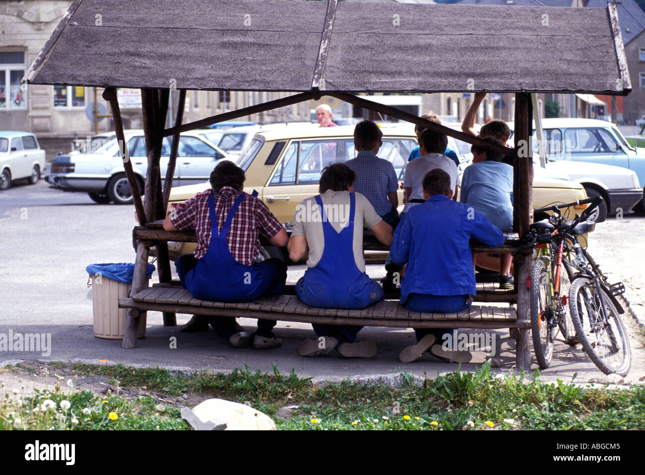 German lorry drivers rest and eat outside a roadside restaurant on the ...