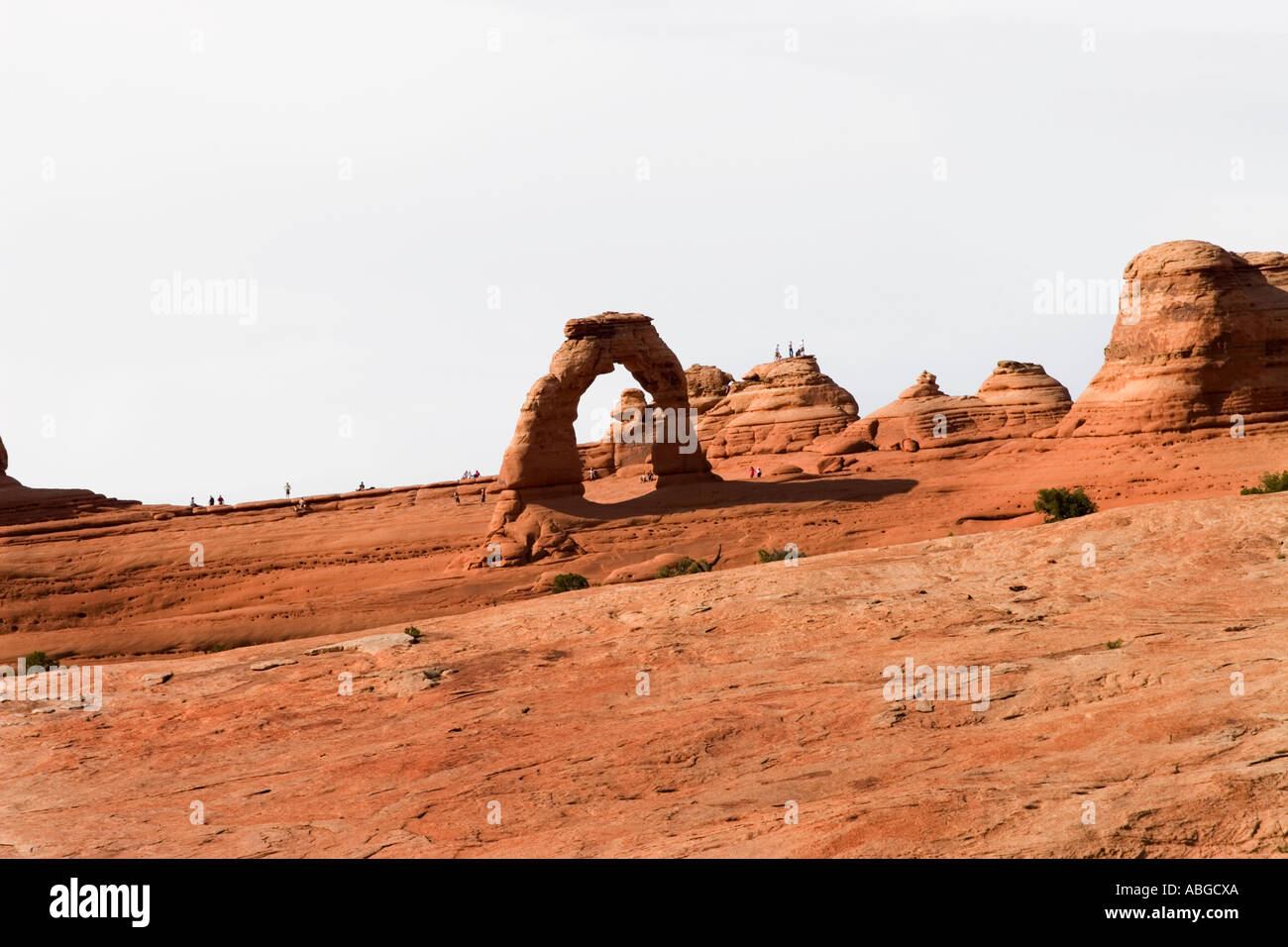 Arches Delicate Arch with tourists Stock Photo - Alamy