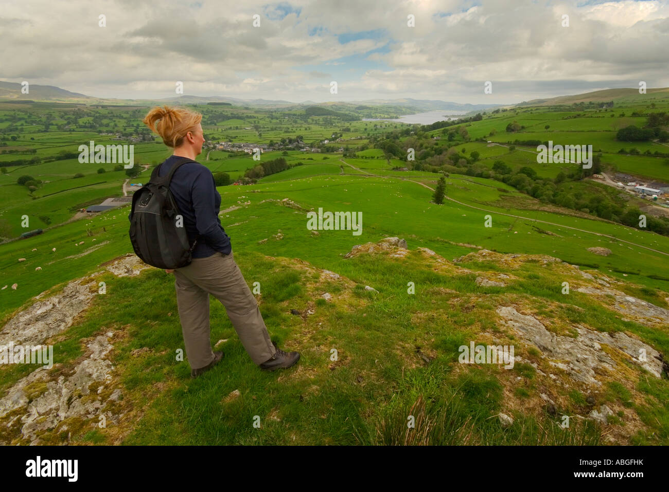Single woman looking to Bala Lake from Moel Ddu Ridge Stock Photo - Alamy