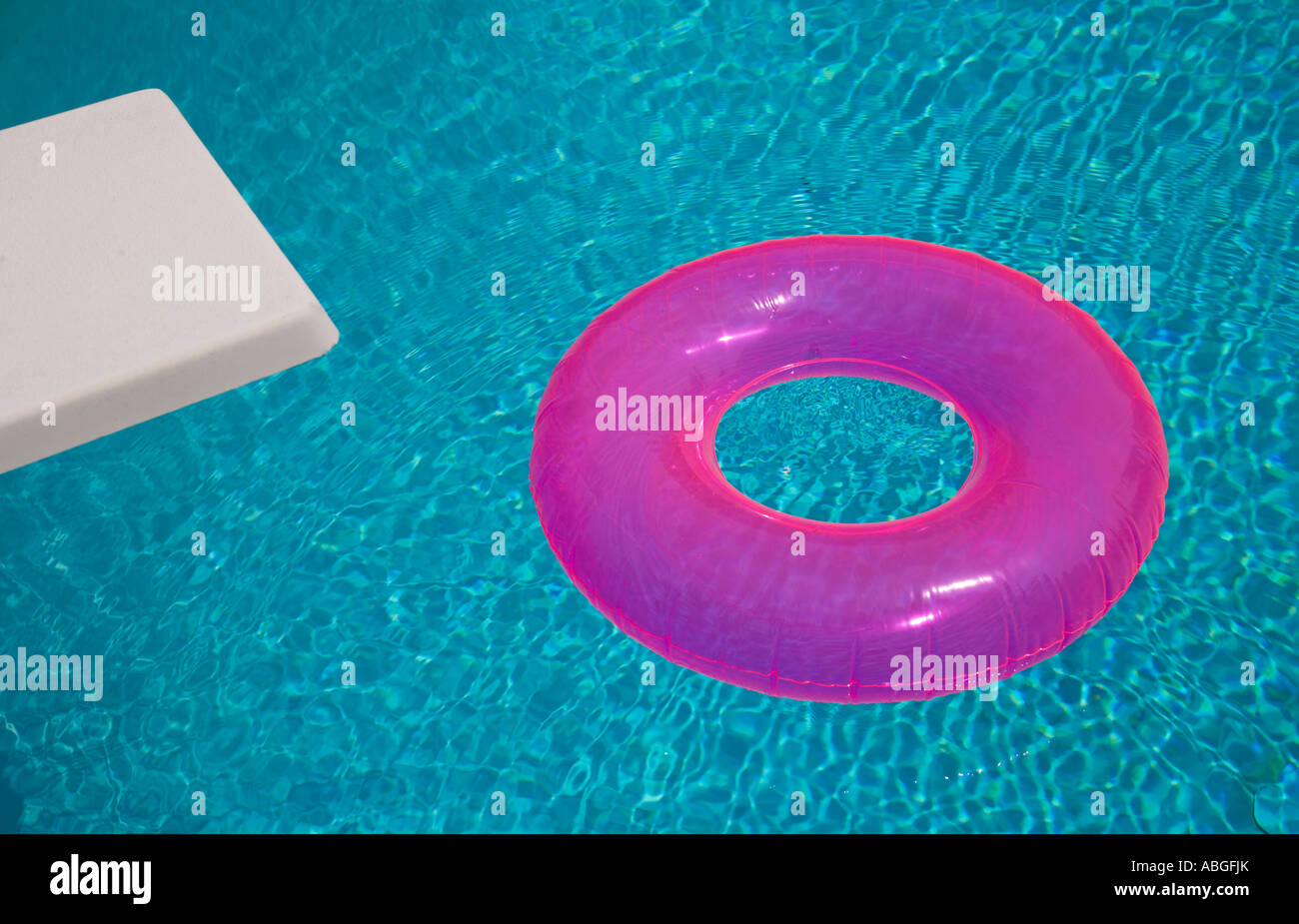 Diving board and inflatable ring in a pool Stock Photo - Alamy