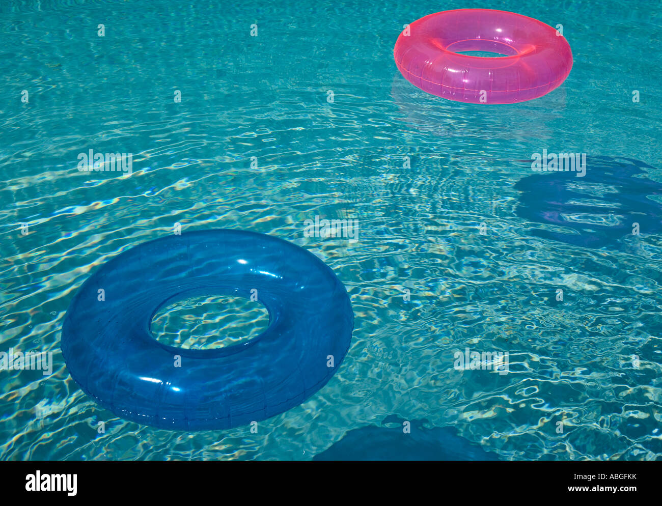 Inflatable rings in a swimming pool Stock Photo - Alamy