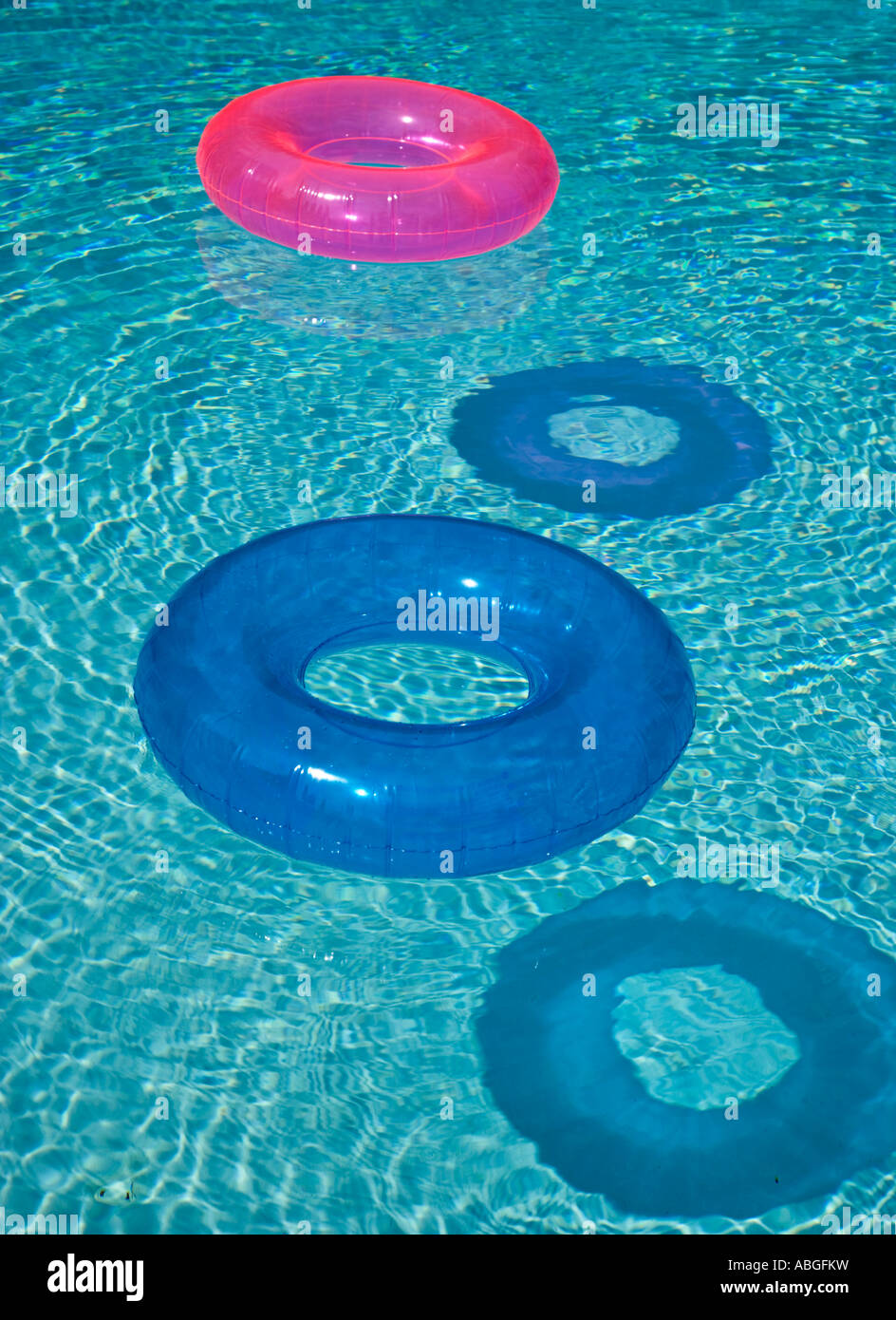 Inflatable rings in a swimming pool Stock Photo - Alamy