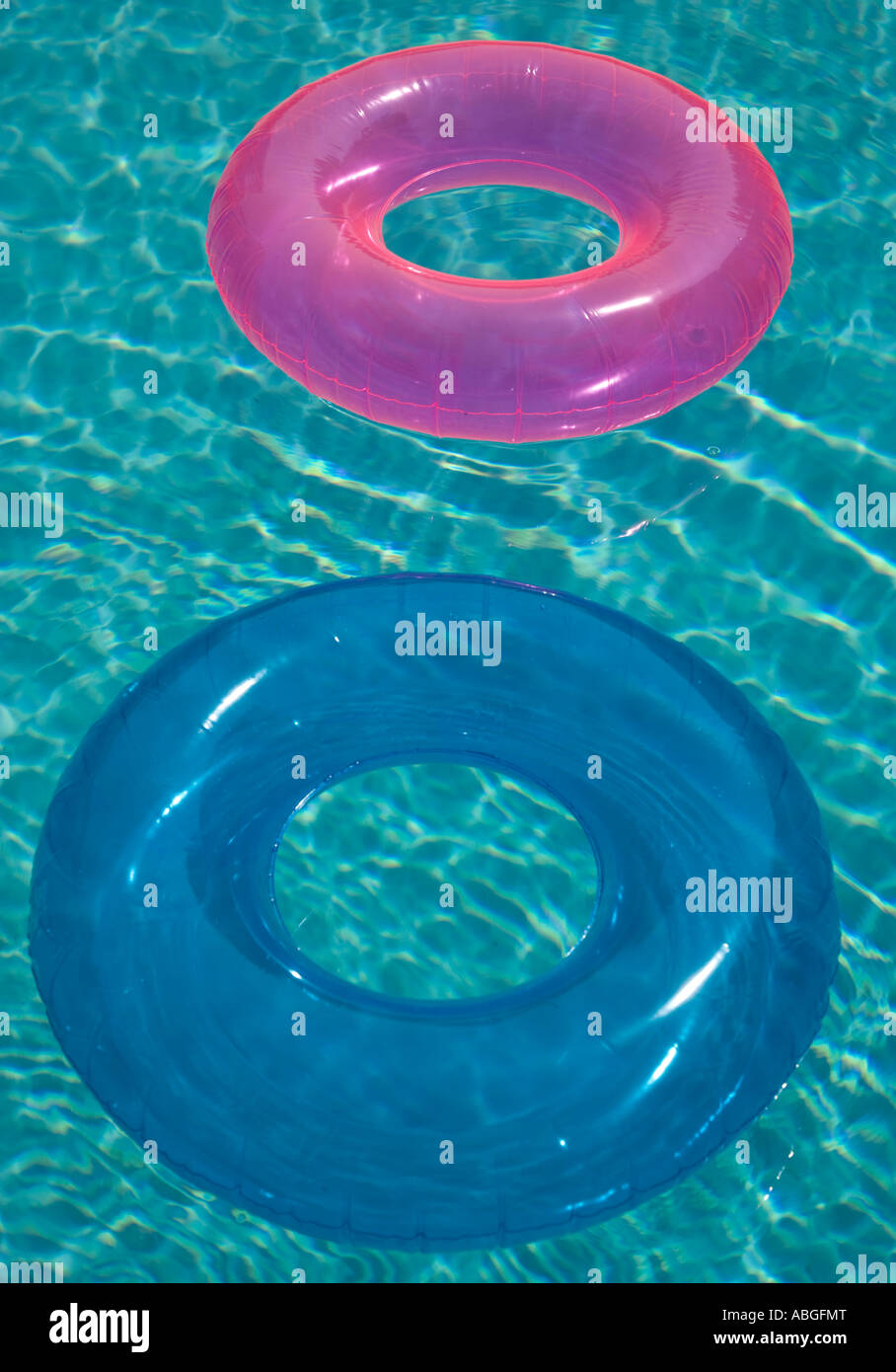 Inflatable rings in a swimming pool Stock Photo - Alamy