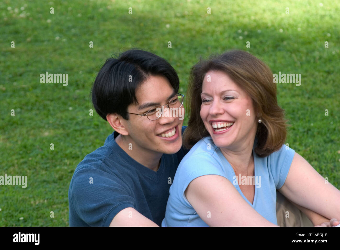 Interracial couple laughing holding hi-res stock photography and images ...