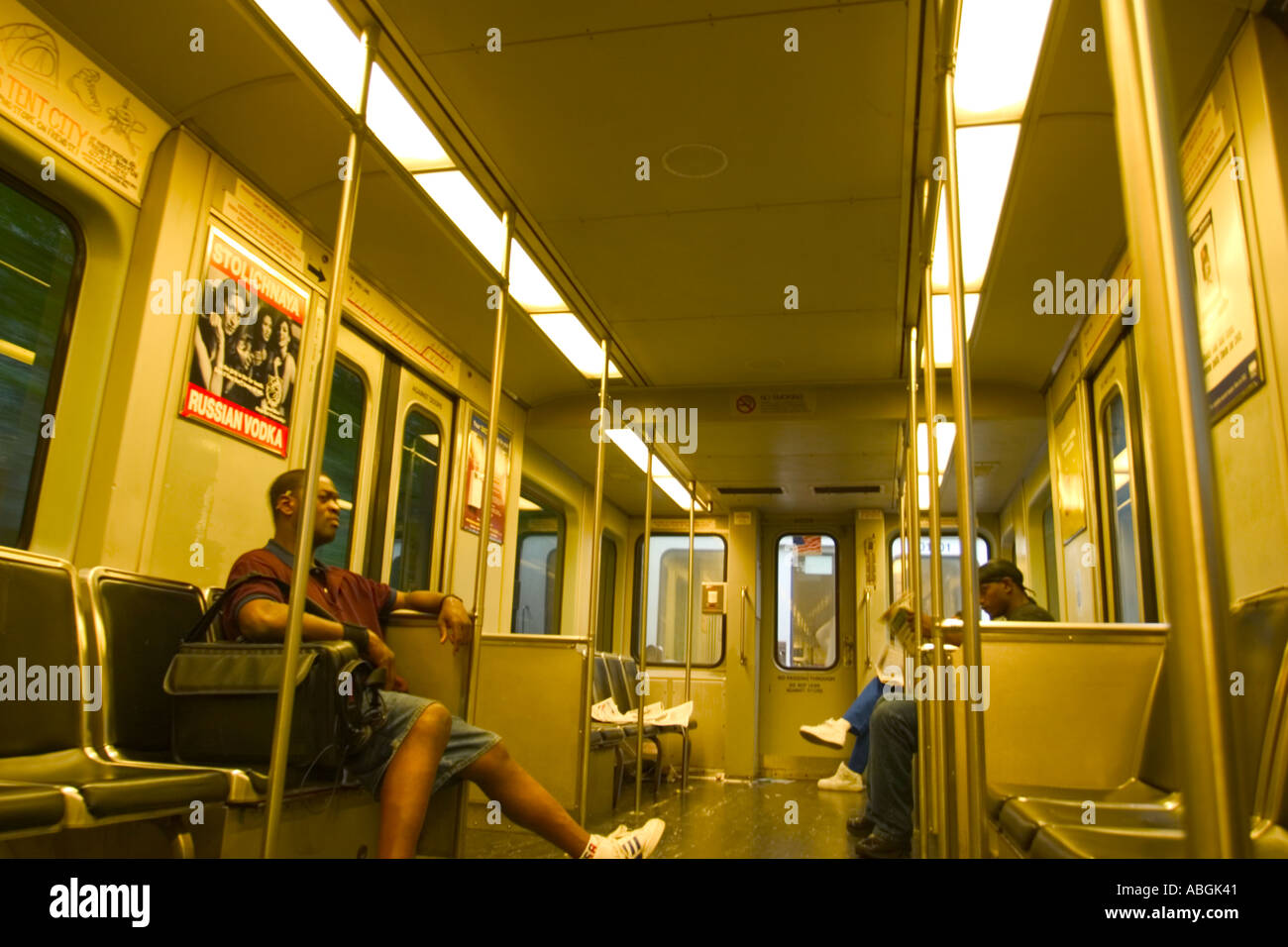Passengers sitting inside an almost empty subway train in Boston ...