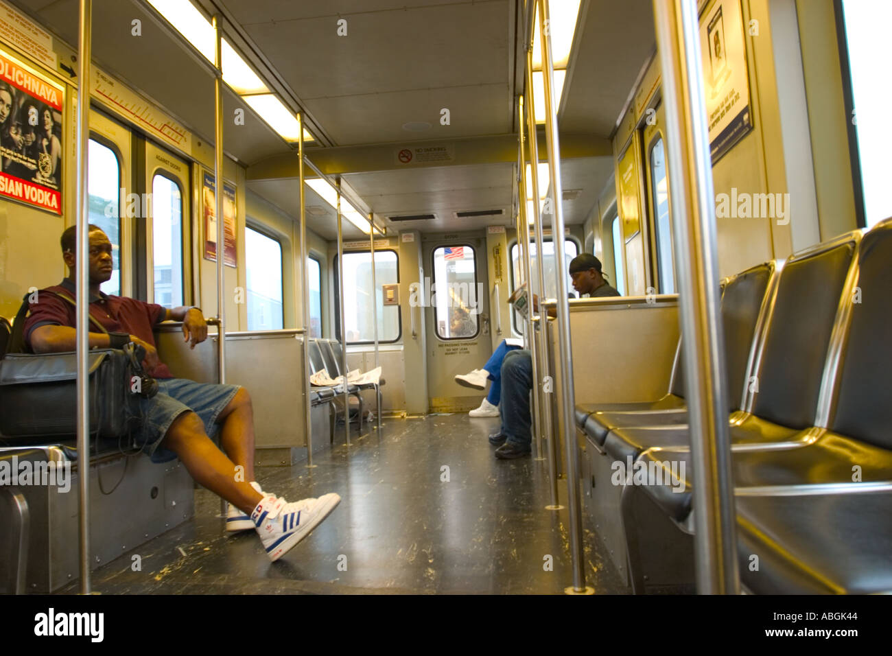Passengers sitting inside an almost empty subway train in Boston ...