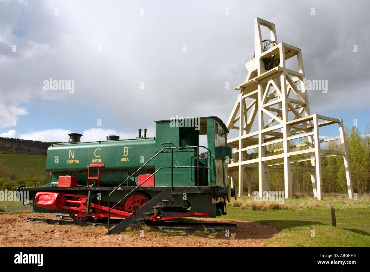 Vintage coal shunting steam train engine and mine pit head Stock Photo ...
