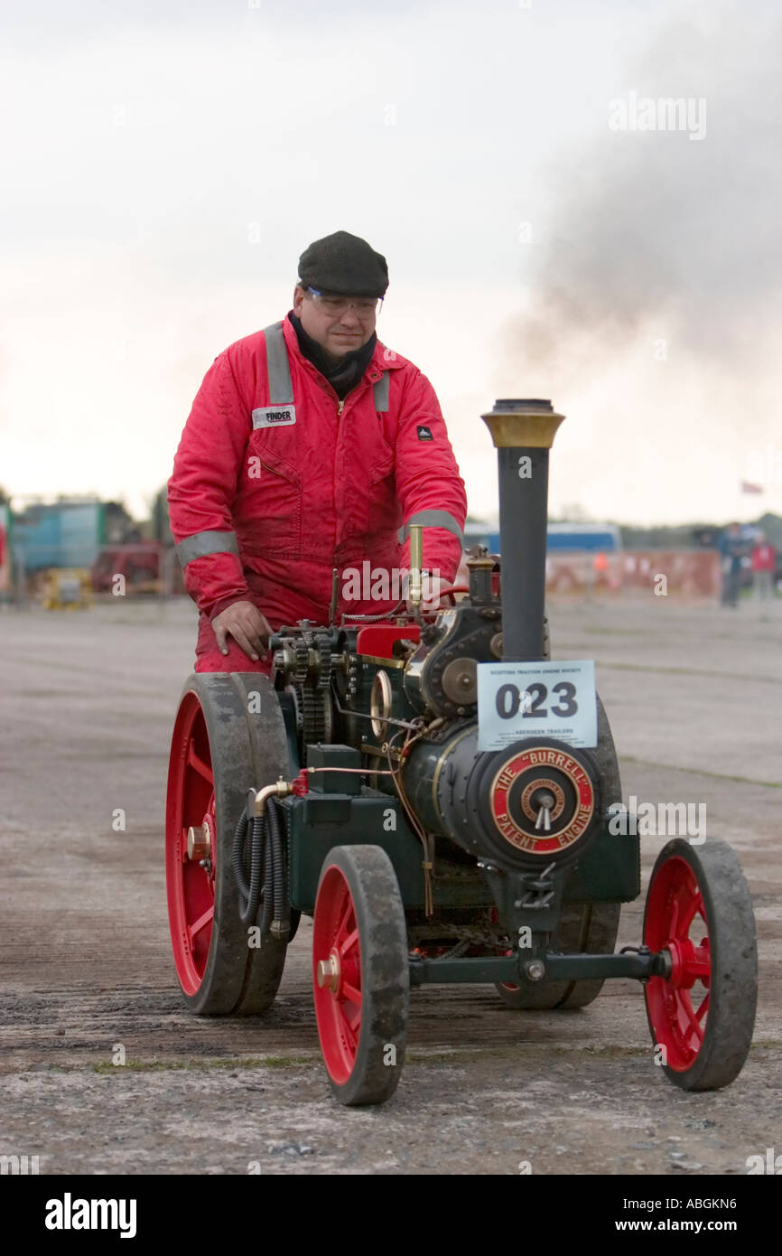 Man driving Burrell 4" SCC Road Loco miniature steam traction engine ...