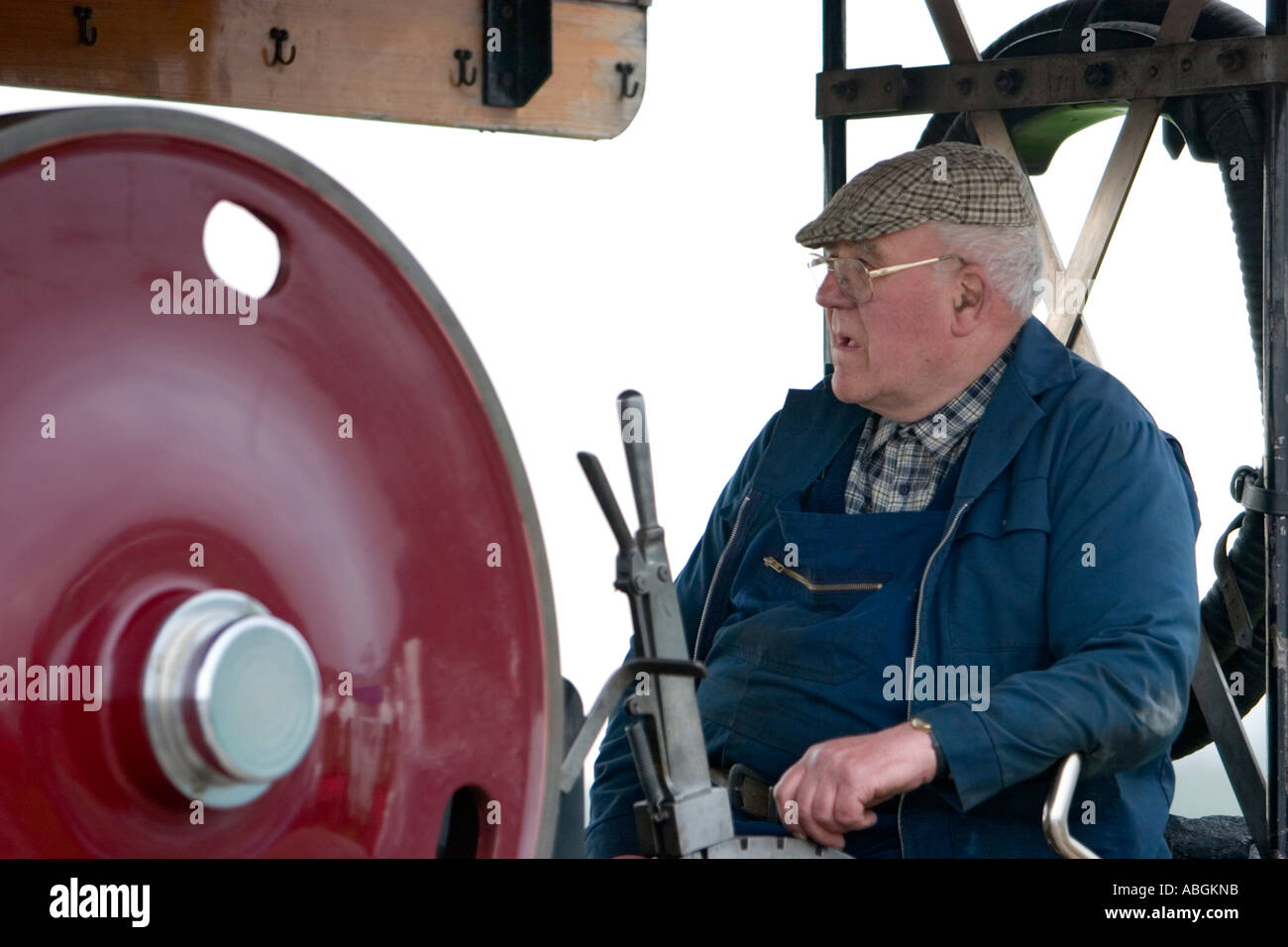 Old man sitting in driving seat of vintage steam traction engine Stock ...