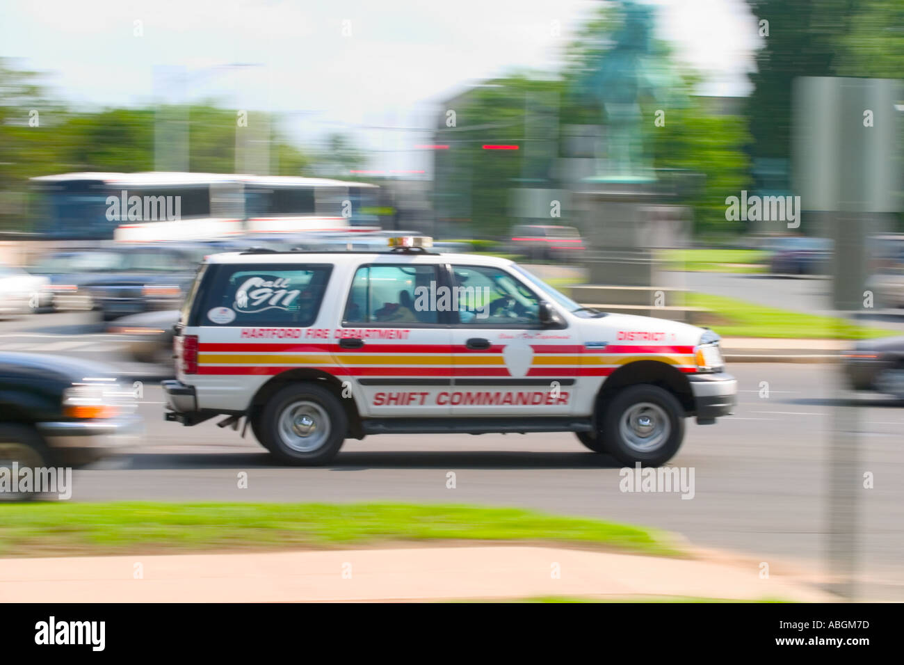 Fire department s Shift Commander car driving on a city street in ...