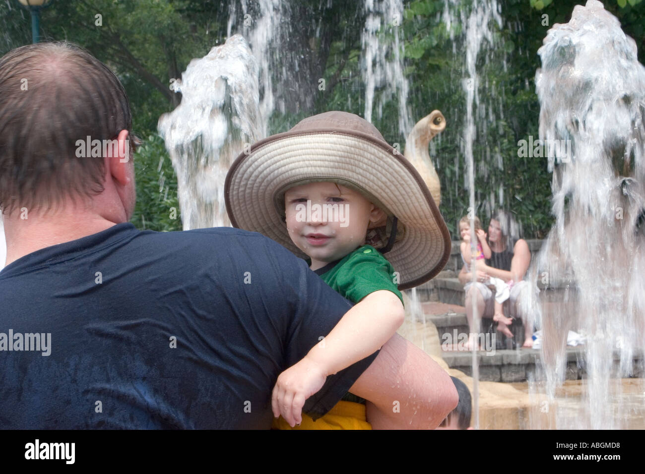 Peeking over Daddys shoulder Stock Photo - Alamy