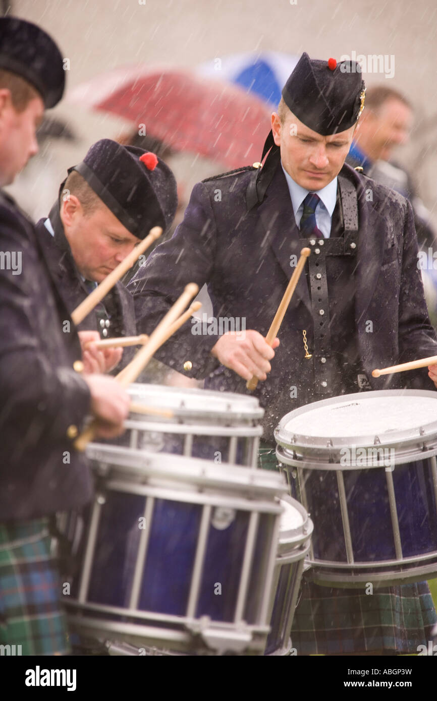 British summer time bad weather pipe band competition drummers druming ...