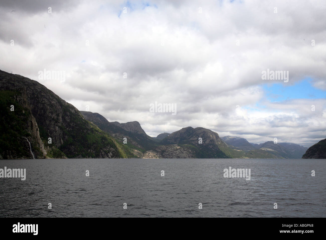 Mountains on the horizon and fjords with clouds hi-res stock ...