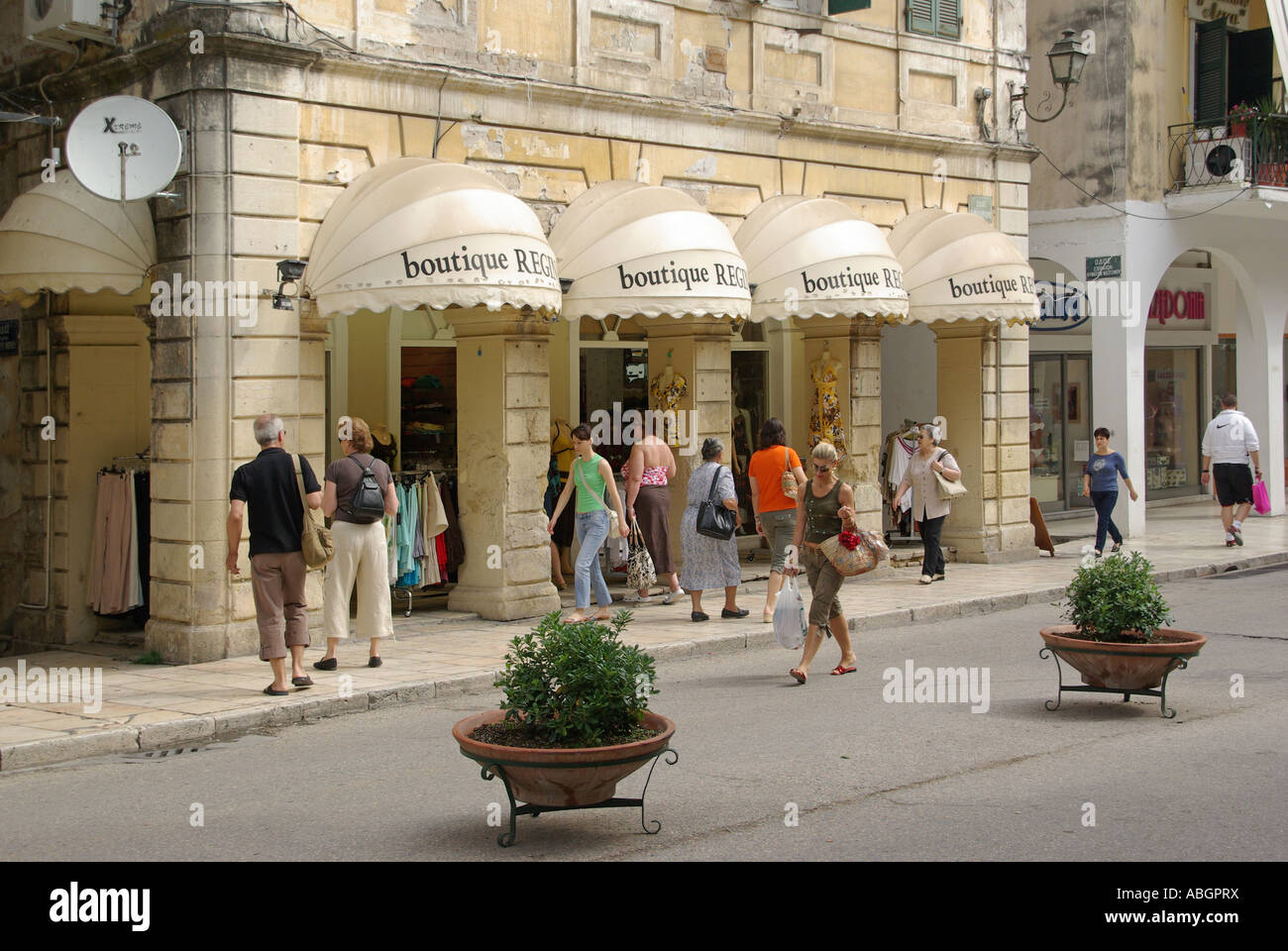 Greek street scene boutique shop windows Corfu Town shoppers in the ...
